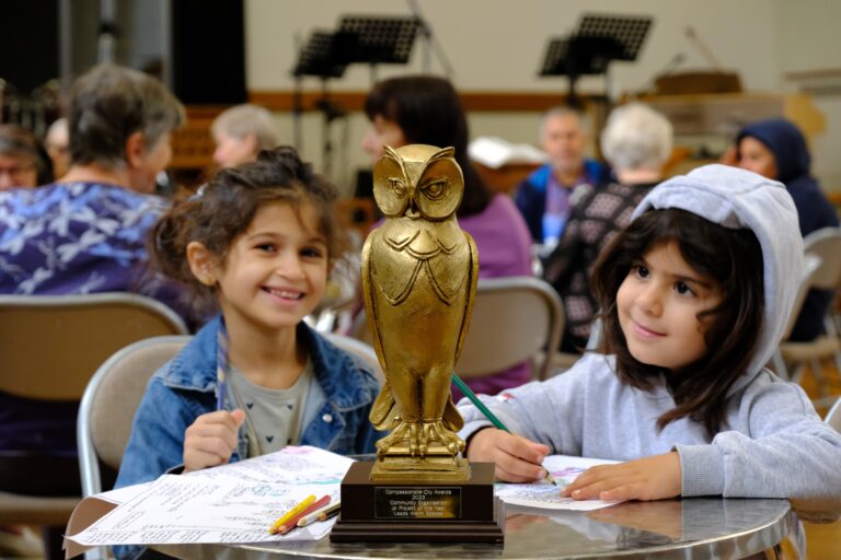 Two young visitors to Warm Space pictured with the “owl” trophy MBC ...